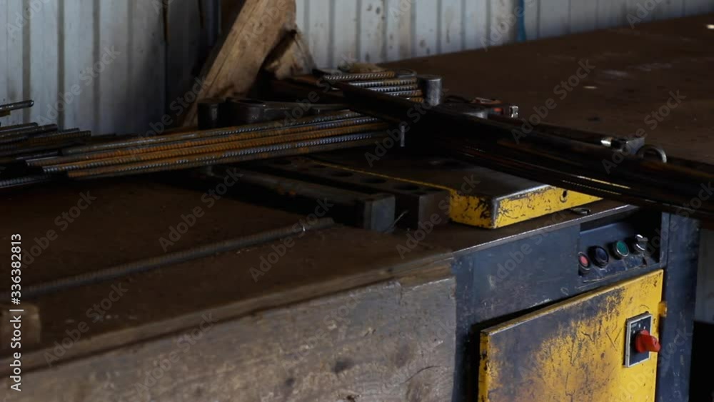 Steel bar bending machine at construction site. Preparing the frame for ...