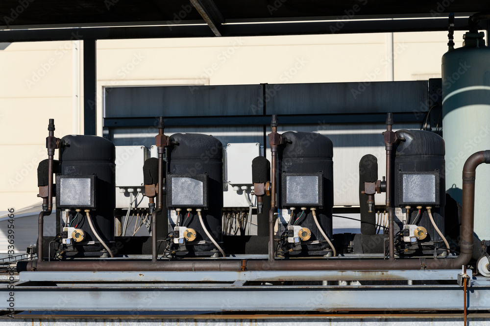 Compressors from cooling units on the roof. Stock Photo | Adobe Stock