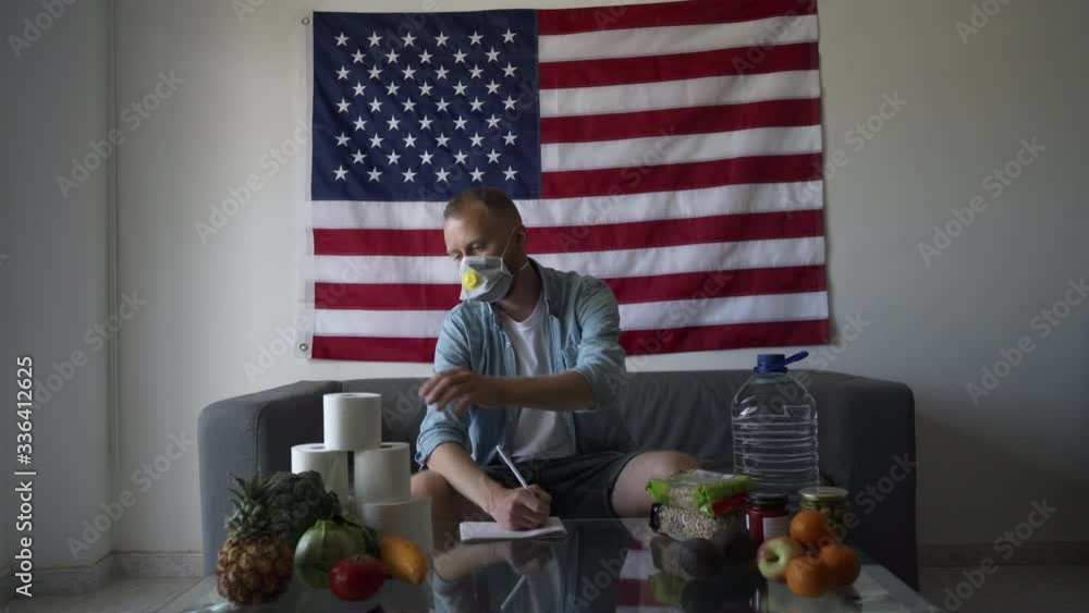 A man in the United States sits on self-isolation while staying at home ...