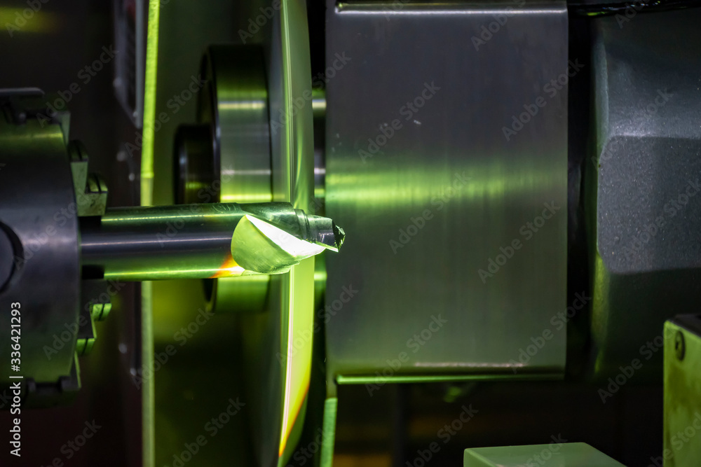 The operation of cutting tool making machine control by CNC program ...