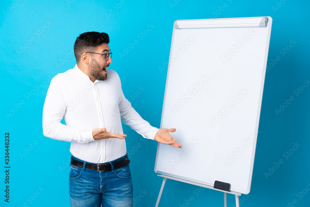 Businessman giving a presentation on white board giving a presentation ...