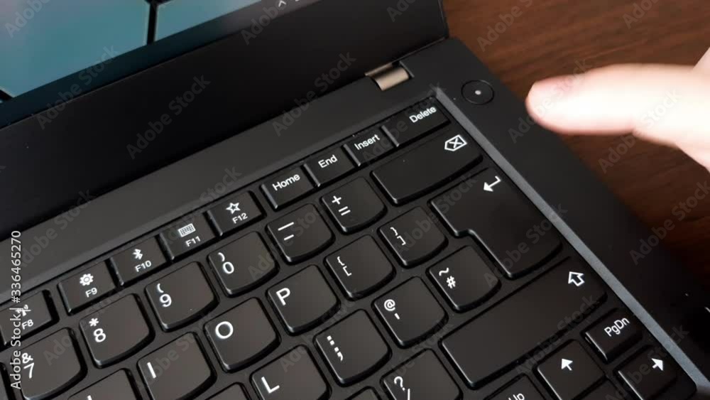 Nervous and stressed person pressing enter key on laptop keyboard ...