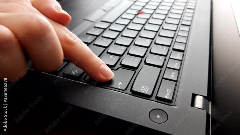 Nervous and stressed person pressing enter key on laptop keyboard ...
