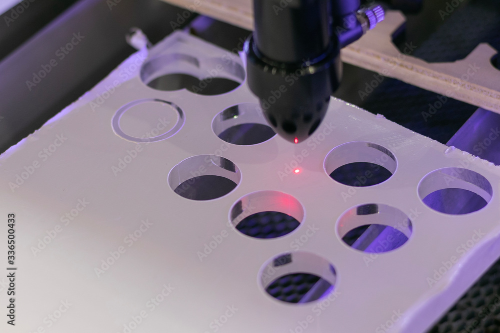 Details of an industrial CNC laser cutting machine. Drilling holes in ...