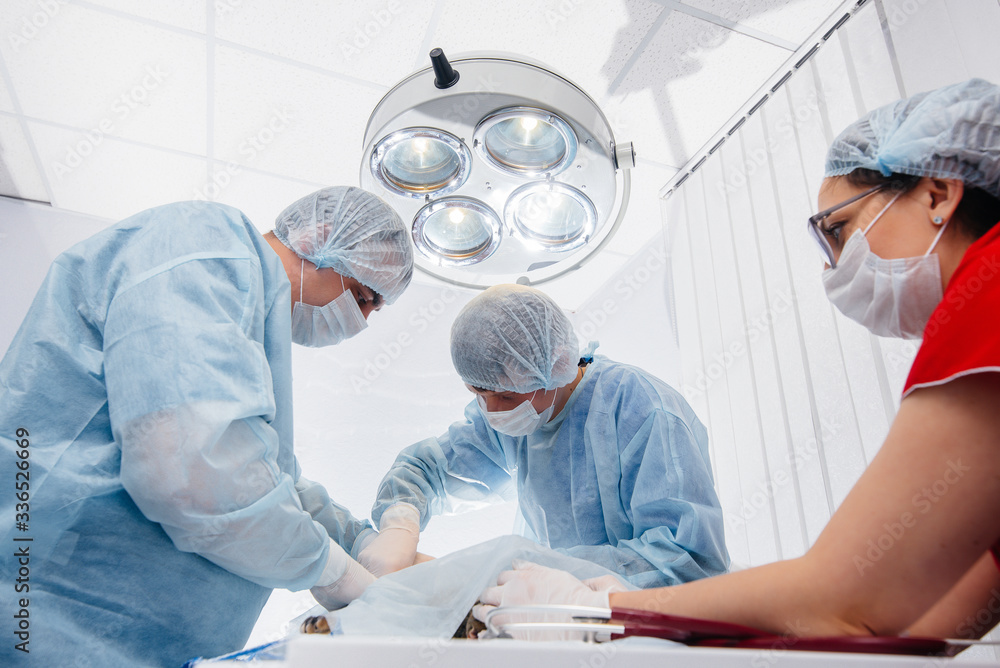 Operation in a modern operating room close-up, emergency rescue and ...