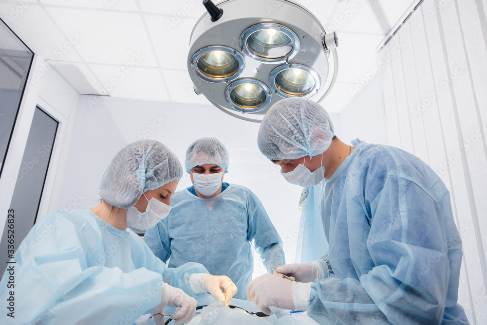 Operation in a modern operating room close-up, emergency rescue and ...