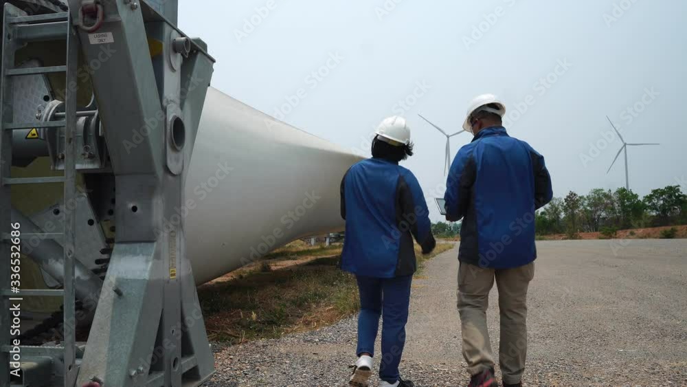 Two engineers are talking about wind turbine system footage 4K Stock ...