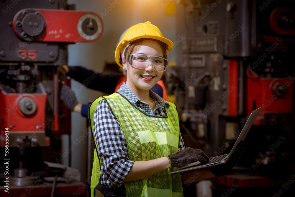 Industry worker woman under inspection and checking production process ...