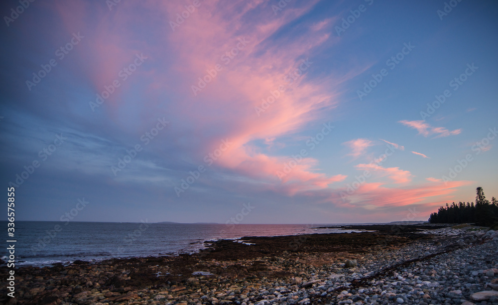Seawall at sunset, a naturally occurring granite and loose boulder and ...