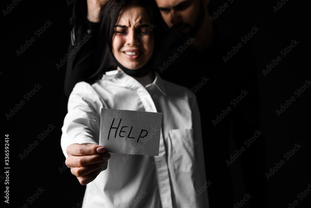 Angry husband trying to kill his wife on dark background. Concept of ...