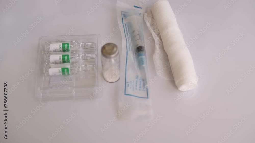 Nurses in a operating room prepare scalpels and medical instruments ...