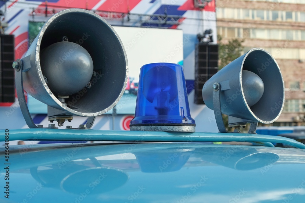 Details of retro police car with a megaphone and flashing blue siren ...