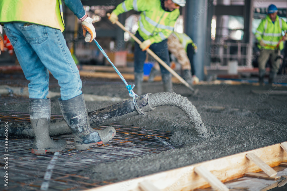 Concrete Pouring by construction worker Stock Photo | Adobe Stock