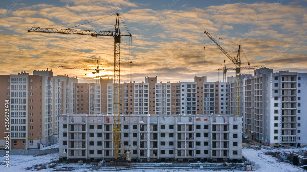 Aerial view of the process of constructing a building. Tower crane on a ...