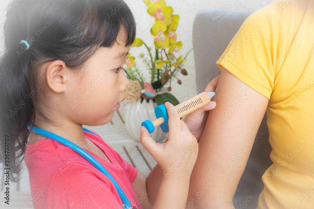 Little girl playing a doctor,boy and girl playing doctor and patient ...