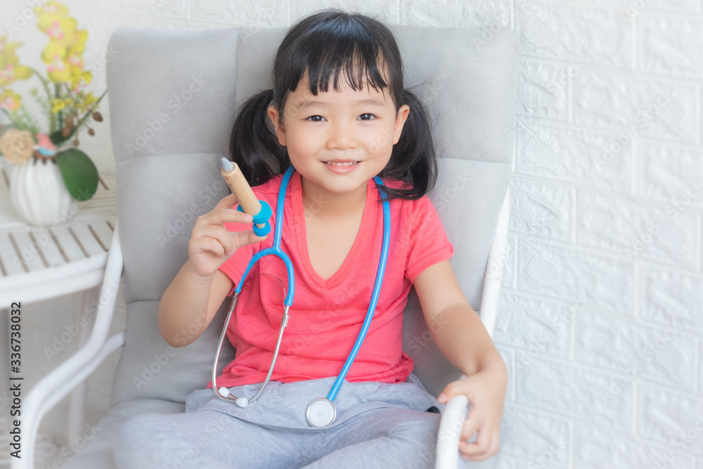 Little girl playing a doctor,boy and girl playing doctor and patient ...