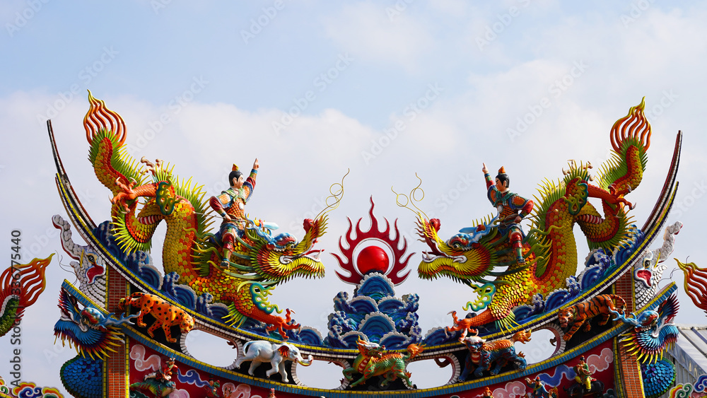 bright multi-colored sculptures of Japanese samurai dragons on the roof ...