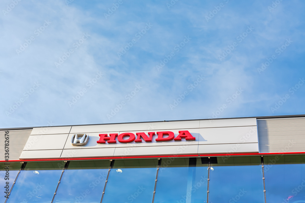 Honda brand logo on bright blue sky background Stock Photo | Adobe Stock