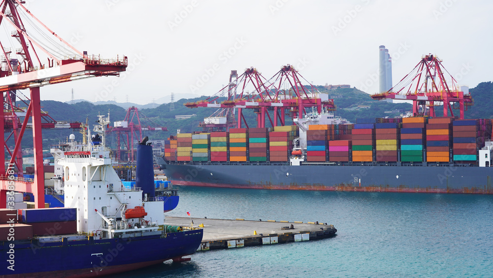 bright multi-colored containers on huge cargo barges in an industrial port. Large container ...