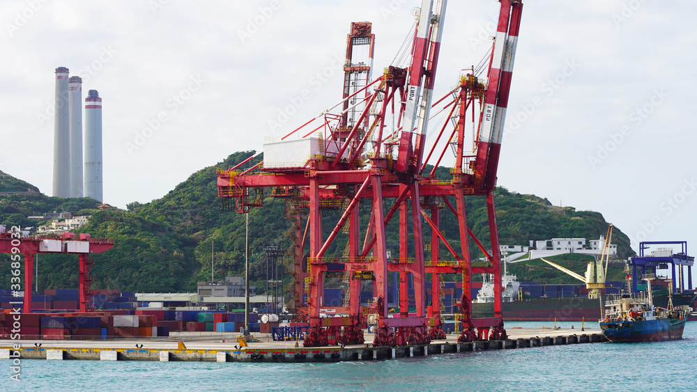 bright multi-colored containers on huge cargo barges in an industrial ...