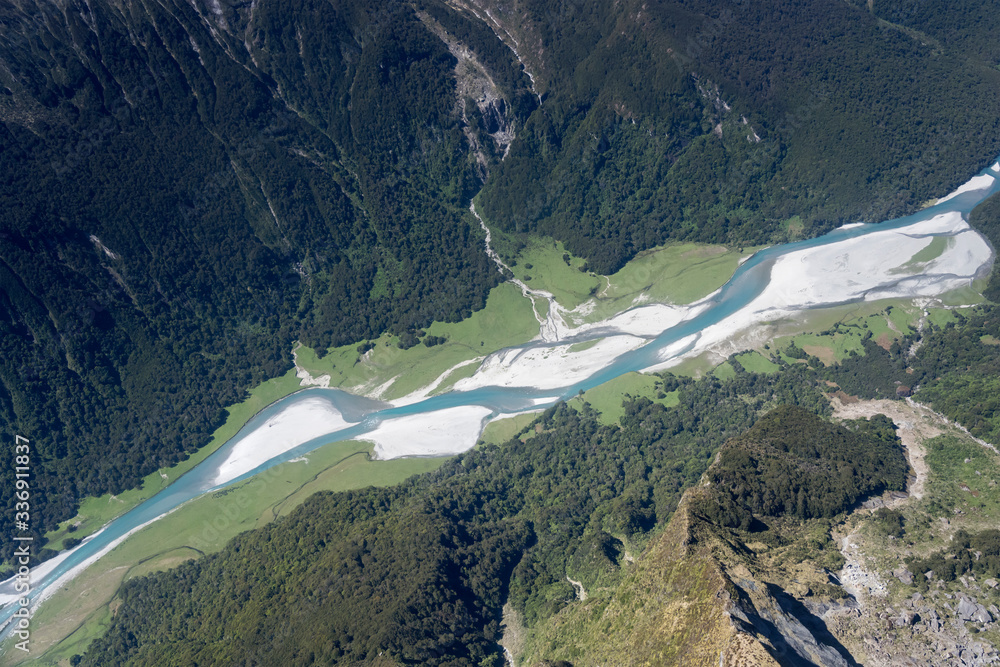 green glades and pebbly riverbed at Wilkin river, from above, New ...