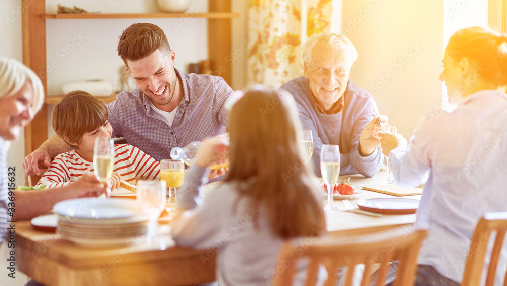 Extended family having lunch at the table Stock Photo | Adobe Stock