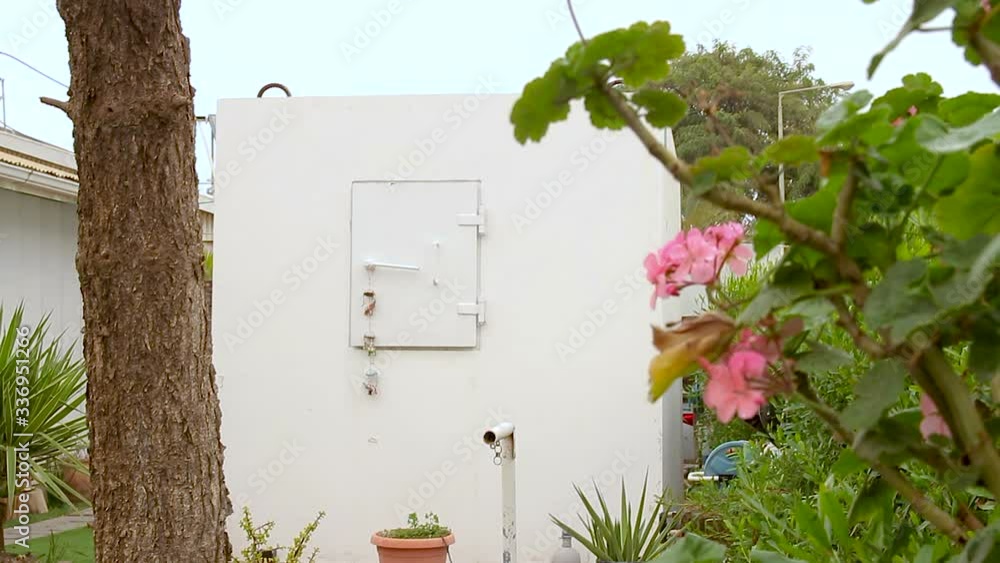 Mobile bomb shelter inside a home garden in Israel. This is an extra ...