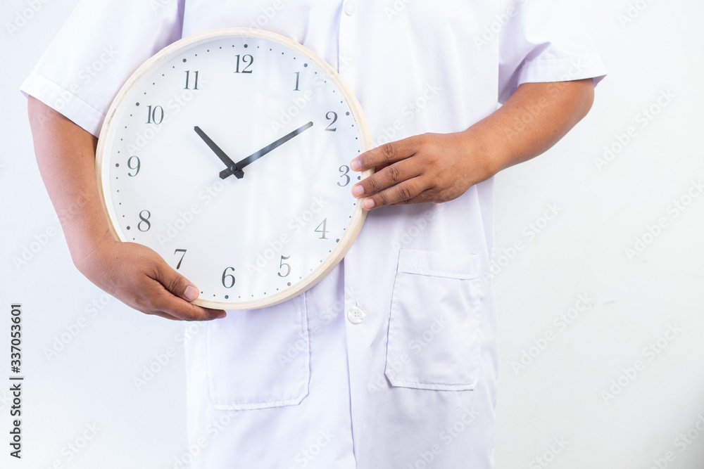 Fotografia do Stock: Young man doctor white uniform withholding time ...