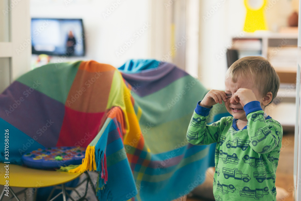 little boy crying at home Stock Photo | Adobe Stock