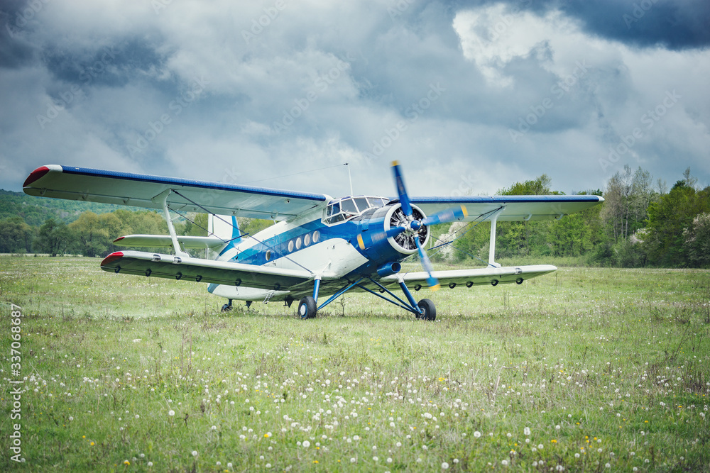 Old retro plane is ready for taking off. Stock Photo | Adobe Stock