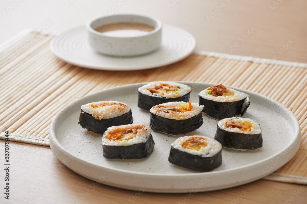 Gimbap is a Korean dish made from cooked rice and other ingredients ...