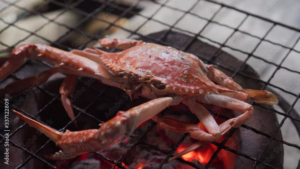 Flower crab get grilling on a traditional stove. Thai seafood menu with ...