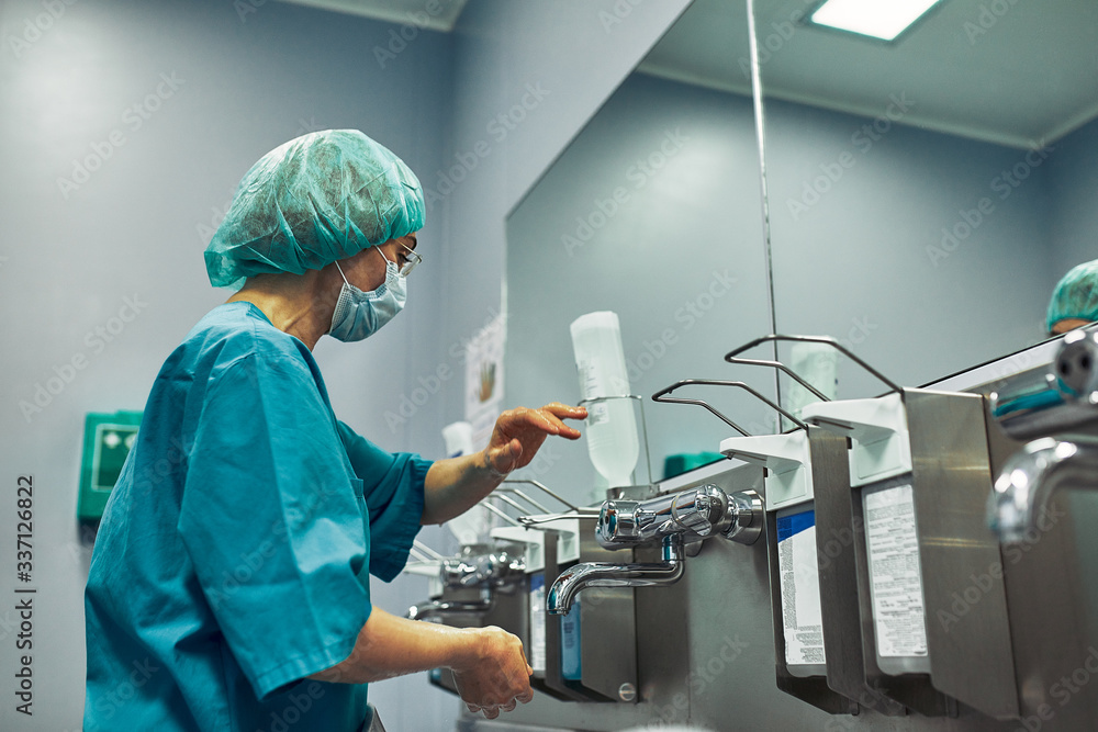 The doctor washes his hands before surgery. Sterility concept. A ...