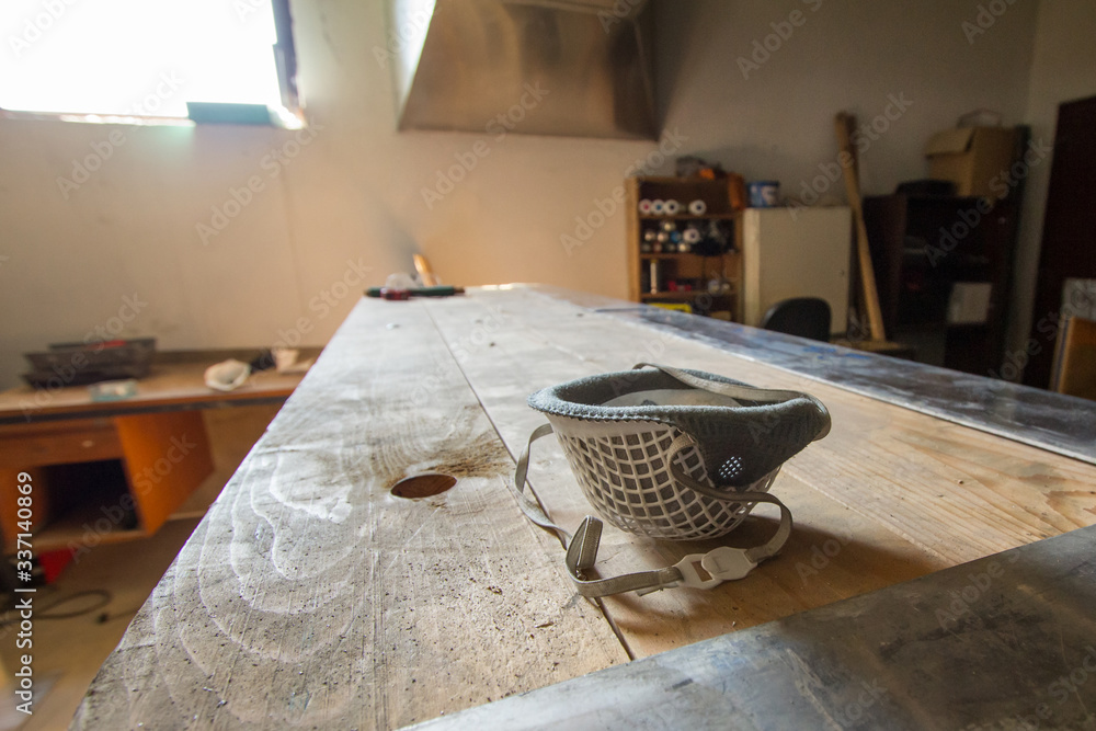 Professional anti dust face mask on display in the workshop of a ...