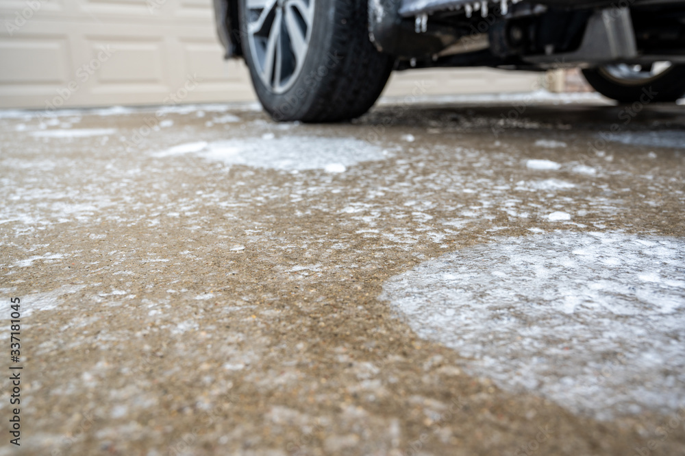 Freezing rain caused buildup of ice on concrete pavement and side ...