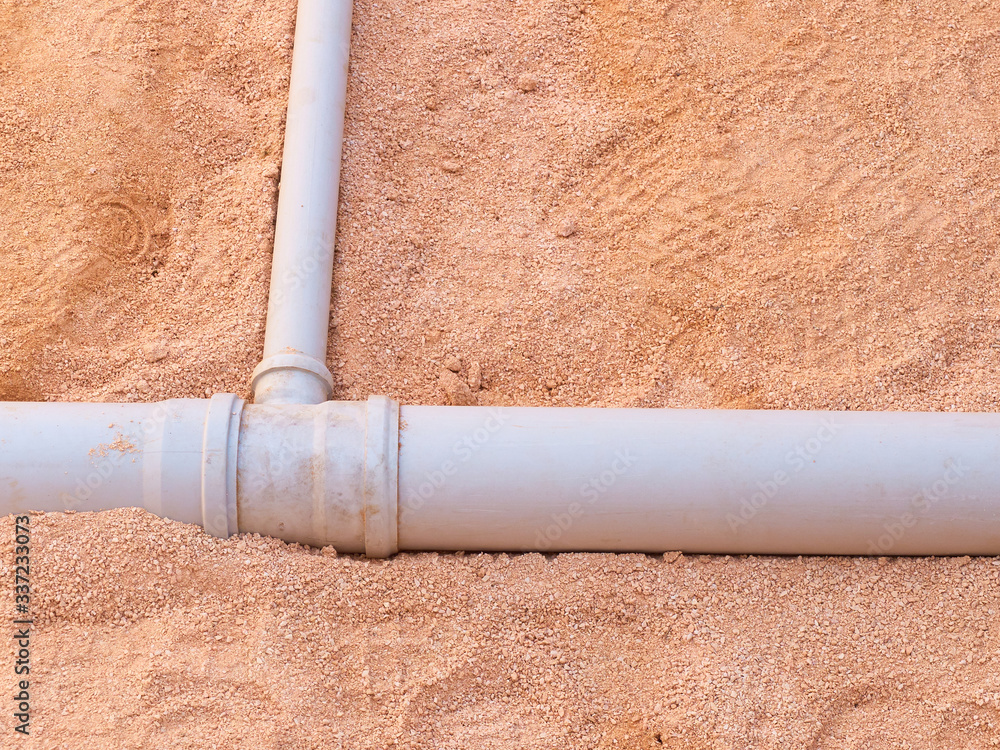 Junction of plastic sewer pipes. Sewage pipeline system of residential ...