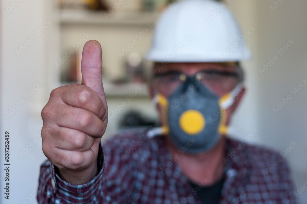 Positive emotion, worker shows thumbs up / Worker shows thumbs up, with ...