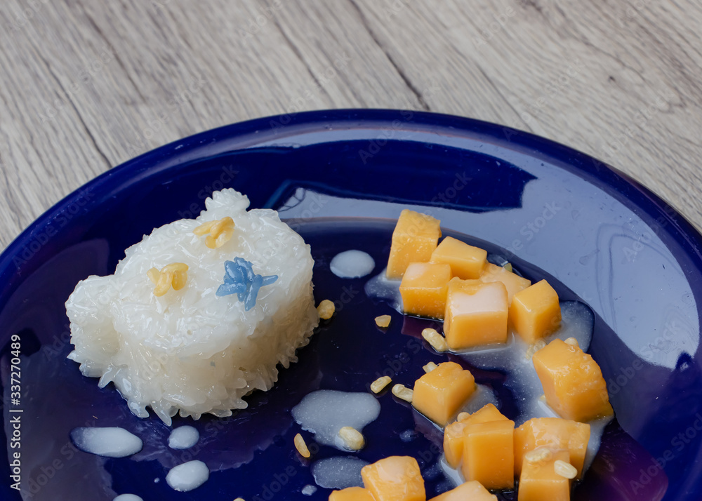 Thai Sweet Sticky Rice in bear shape with fresh mango. A traditional ...