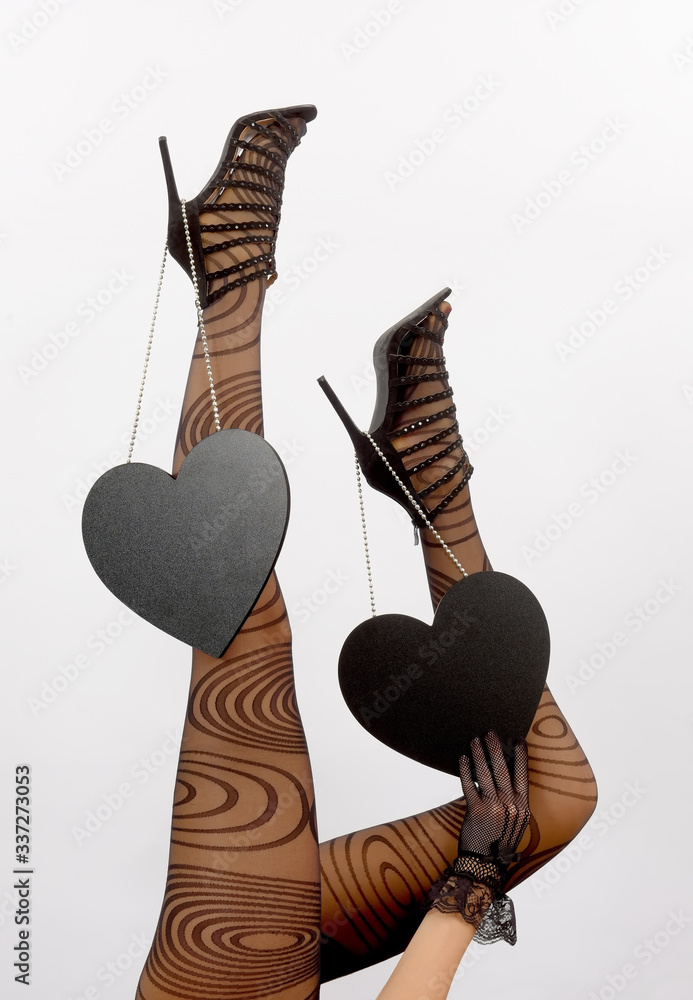 A female model's long legs are stretched out high in a vertical form in ...