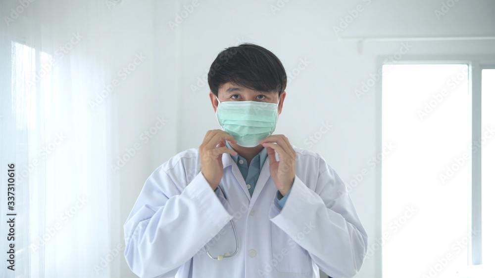 Medical concepts. The doctor is wearing a mask in the hospital. 4k ...