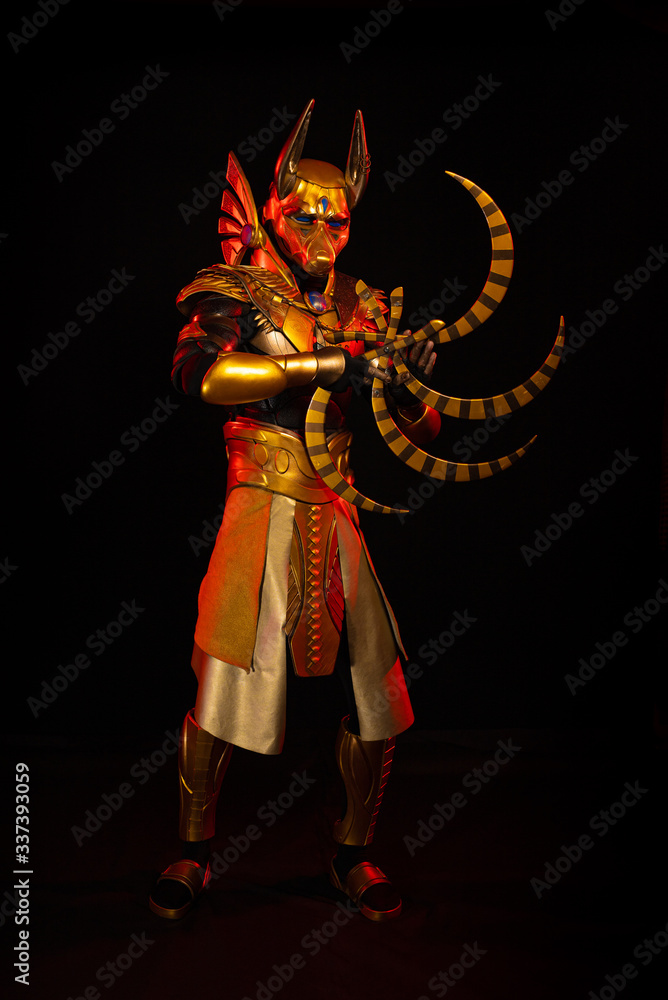a male actor in a suit of an Egyptian mythology character, the golden ...