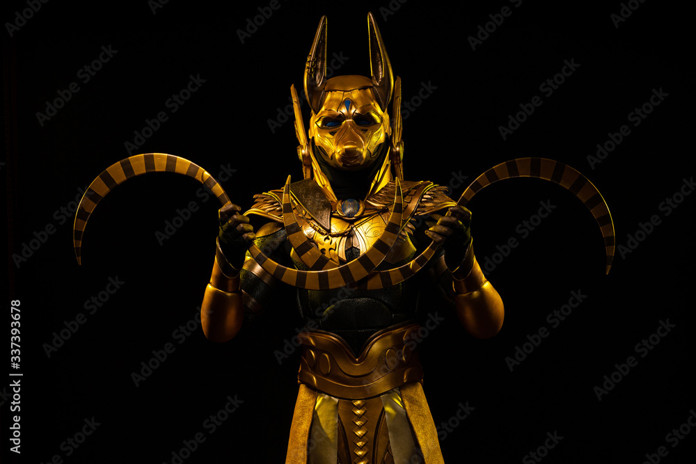 a male actor in a suit of an Egyptian mythology character, the golden ...