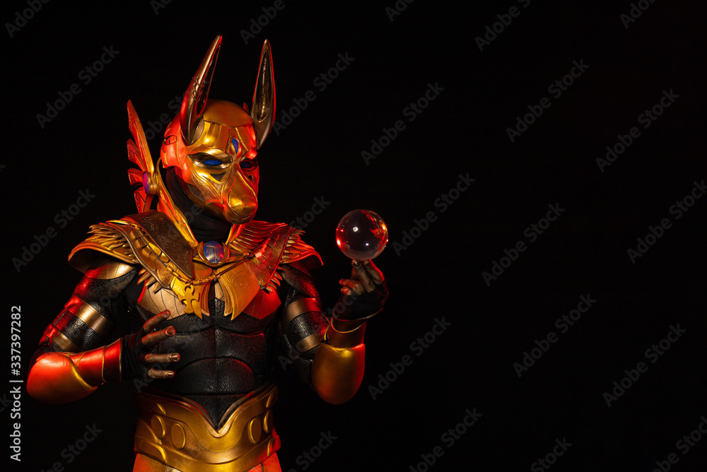 a male actor in a suit of an Egyptian mythology character, the golden ...