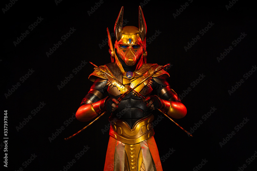 a male actor in a suit of an Egyptian mythology character, the golden ...