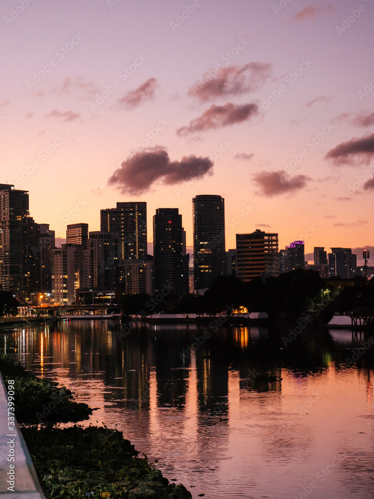 Skyline of Makati City reflecting in the Pasig River in Metro Manila ...