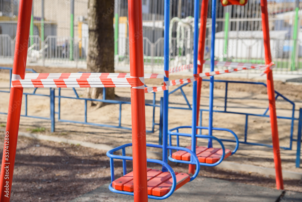 Children's playground closed and wrapped in alarm caution tape for ...