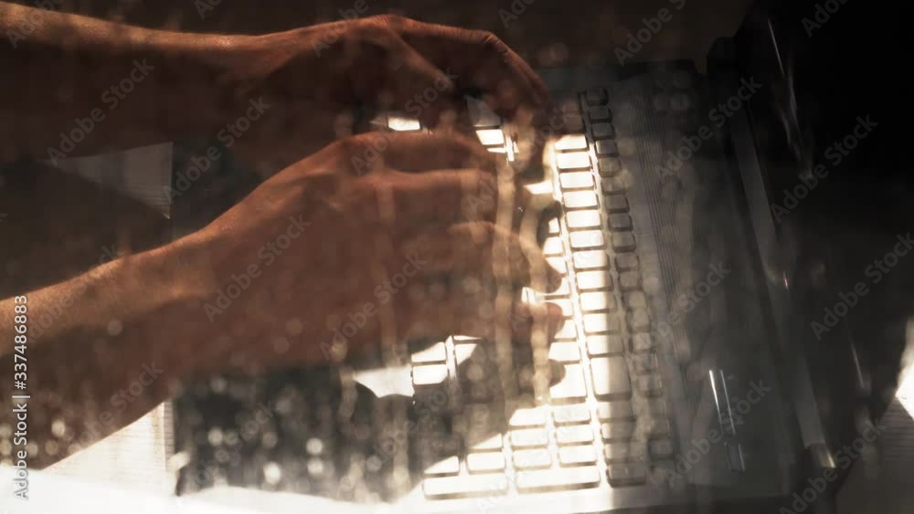 Guy is working for the laptop alone outside the window with drops after ...