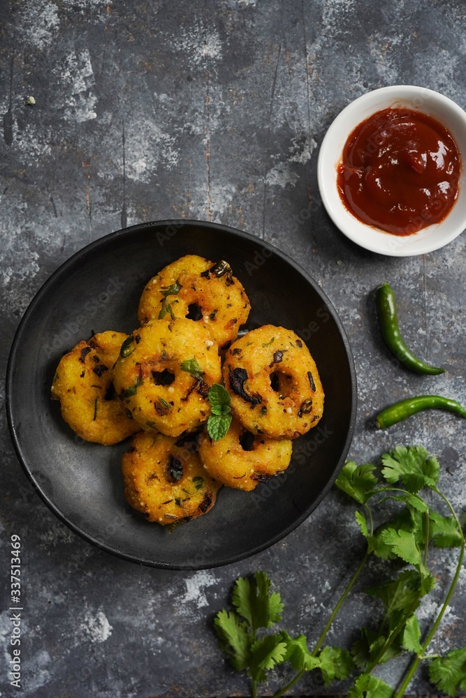 Vada/ Vadai - Tea time spicy snack with leftover rice Stock Photo ...