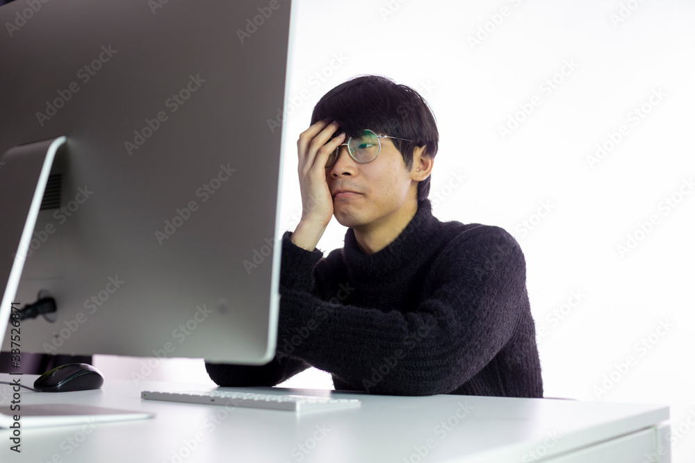 Chinese overworked men in glasses sitting in office, looks exhausted ...