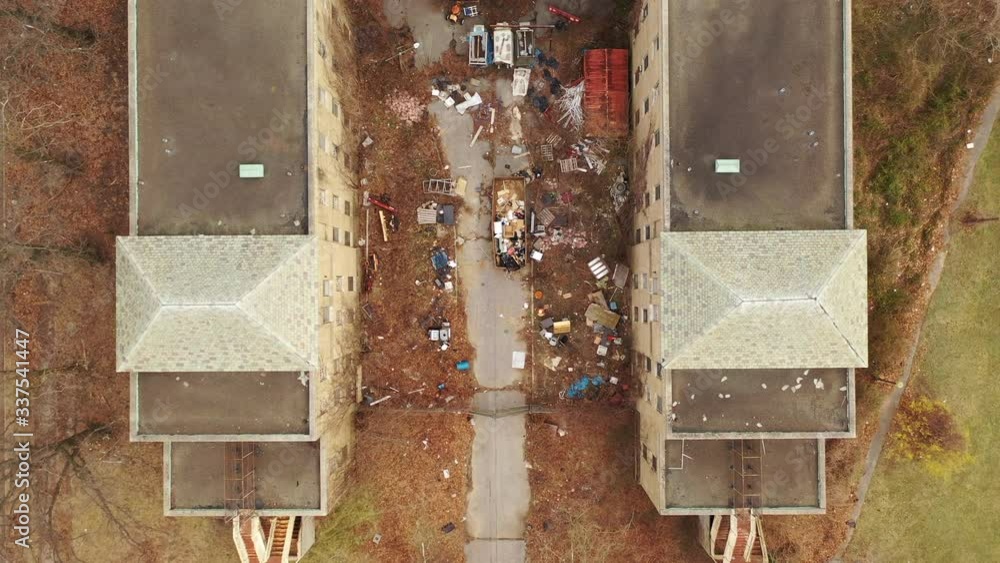 a top down shot directly over an abandoned building. The drone camera ...